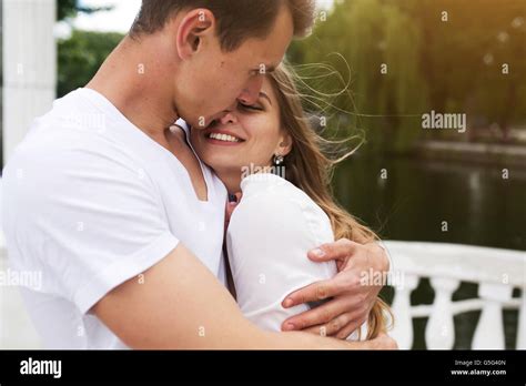 Guy Hugging His Girlfriend Stock Photo Alamy