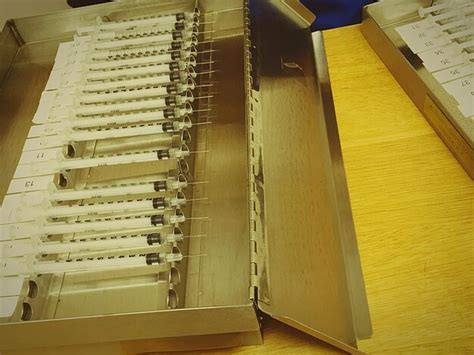 Premium Photo Close Up Of Syringe Stand