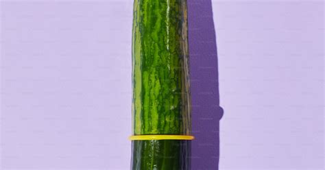 Minimal Shot Of Single Cucumber With Condom On Pastel Background Safe
