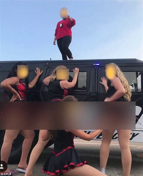 High School Dance Team And Their Adult Coach Pose For Provocative