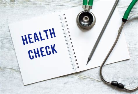 Premium Photo Health Check Is Written In A Notebook On A Light Wooden