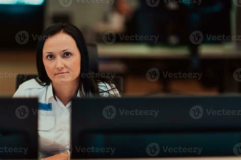 Female Security Operator Working In A Data System Control Room Offices Technical Operator