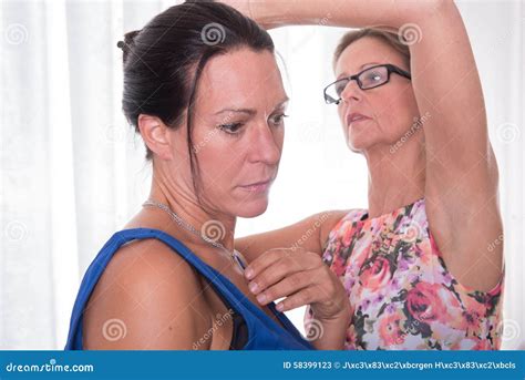 Two Attractive Women Getting Ready For The Evening Stock Image