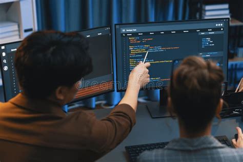 Smart It Developer Looking At Coding Program Application At Back Side Infobahn Stock Image