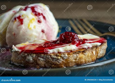 White Mozzarella Cheese Served With Raspberry Jam And A Slice Of Whole