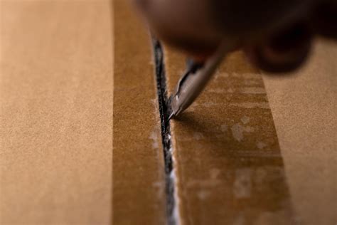 Close Up Of Woman S Hand Opening Box Using Cutter Hands Unpacking