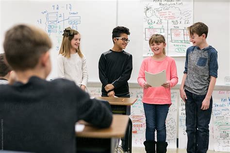 Classroom Students Present Group Project In Front Of Class By Stocksy Contributor Sean Locke Classroom Students Present Group Project In Front Of Class By Stocksy Contributor Sean Locke