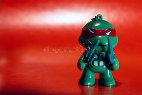 A Small Plastic Toy Depicting A Ninja A Horizontal Photo On A Red Background Editorial