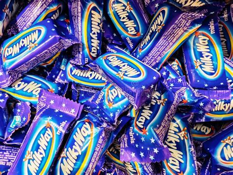 Colorful Assortment Of Milky Way Candy Bars In Purple Wrappers Displayed In Bulk For Sale At A