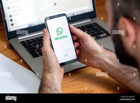 Whatsapp App Logo On The Phone Screen In A Mans Hands Smartphone With