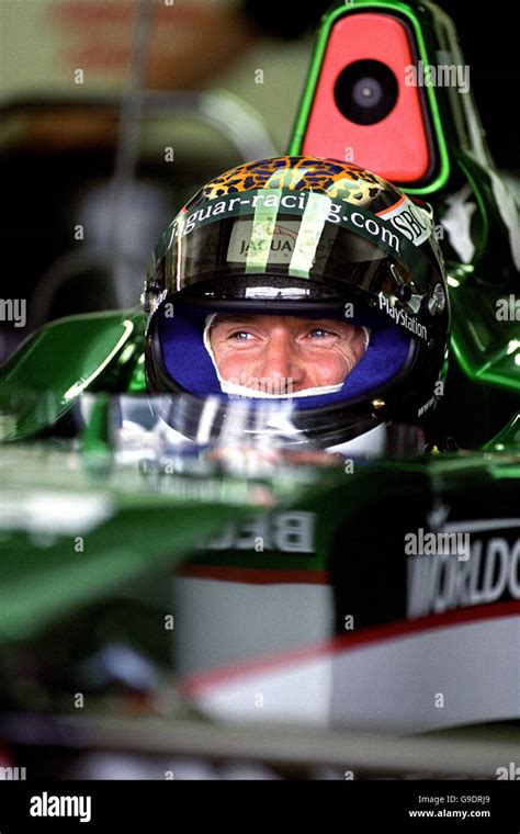 Eddie Irvine Looks On From The Cockpit Of His Jaguar Hi Res Stock