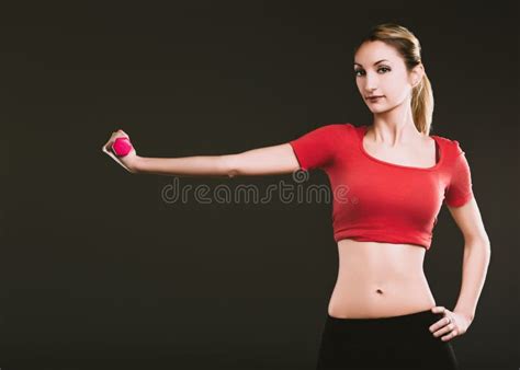 Young Woman Lifting Dumbbell Showing Healthy Lifestyle Stock Image