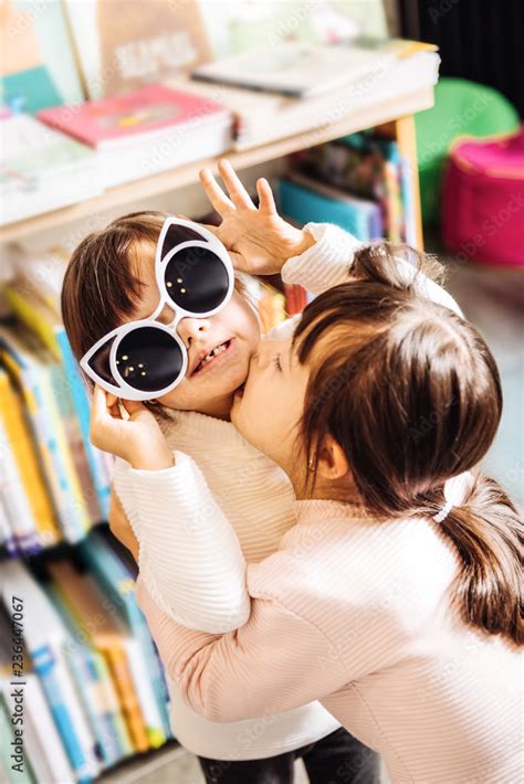 Cute Loving Dark Haired Twins Hugging And Kissing Each Other Stock Photo Adobe Stock