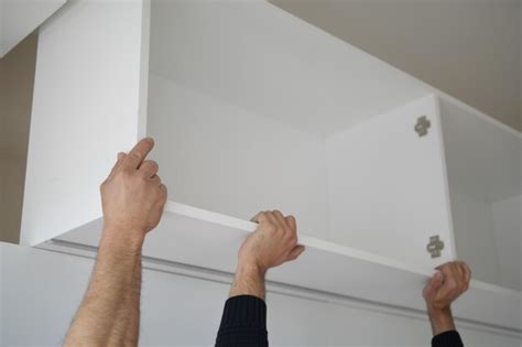 premium photo installing a modern white cabinet in your home a