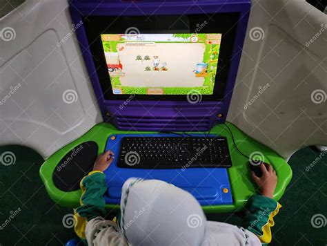 Happy Smiling Asian School Girl Using Laptop Computer At Class In