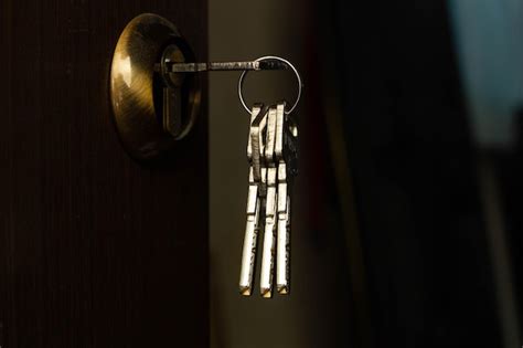 Premium Photo Bunch Of Keys Sticks Out Of The Door Lock Stainless Steel Keys Protrude From A