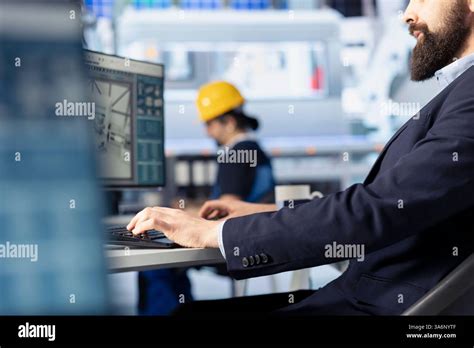 Solar Panels Manufacturing Plant Worker Analyzing Performance Data And