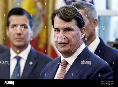 Ford Ceo Jim Farley L Listens As Stellantis Ceo Antonio Filosa R
