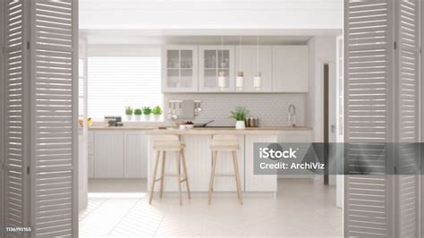 섬 발판 및 펜 던 트 램프 내각 및 부속품 백색 인테리어 디자인 디자이너 개념 흐림 배경으로 현대 스칸디나비아 부엌에 열리는 백색 접히는 문 가정의 방에 대한 스톡 사진