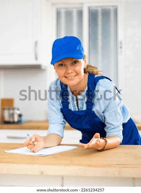 Professional Female Cleaner Uniform Taking Notes Stock Photo 2261234257 Shutterstock