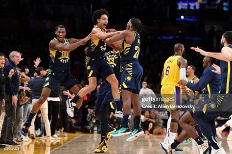 Andrew Nembhard Of The Indiana Pacers Celebrates With His Teammates