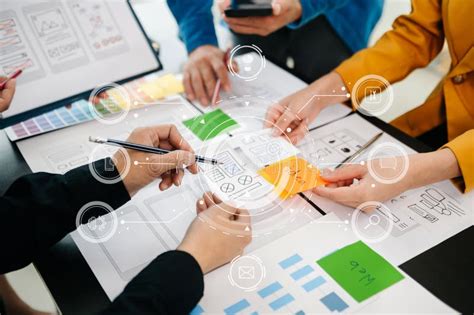 Ux Developer And Ui Designer Brainstorming About Mobile App Interface Wireframe Design With