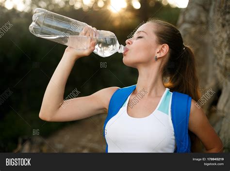 Woman Drinking Water Bottle