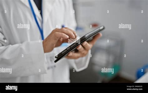 Handsome Middle Aged Scientist Manly Diving Into Tech Using Touchpad In Clinical Laboratory