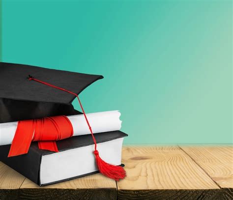 Premium Photo Graduation Cap With Books And Degree