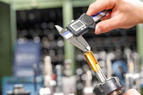 Measuring A Cutting Tool With A Caliper For A Cnc Machine Tool Stock Image Image Of Automated