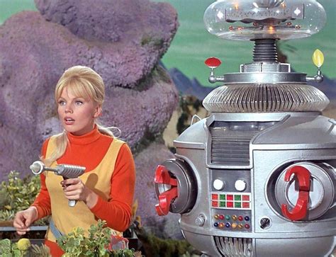 Marta Kristen As Judy Robinson Posing With The Robot In A Promo Shot