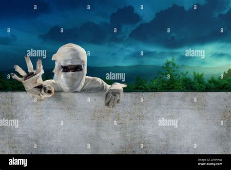 Mummy Comes From Behind The Wall With A Night Scene Background