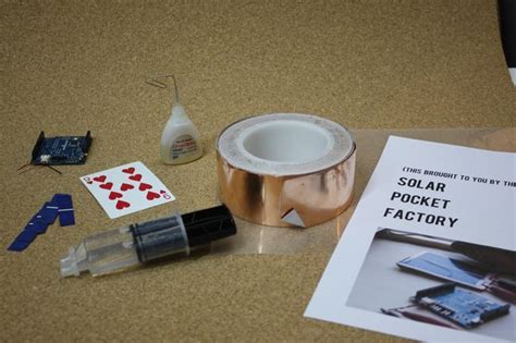 Solar Powered Arduino On The Back Of A Playing Card