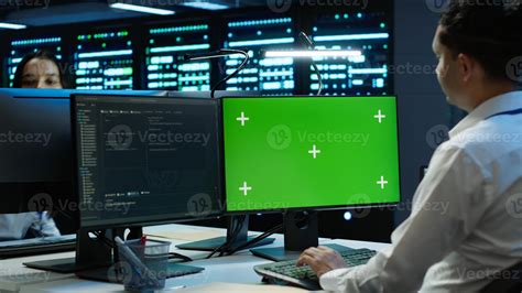 engineer in data center monitoring security threats using mockup