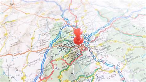 A Red Pin Stuck In Clermont Ferrand On A Map Of France Editorial Stock