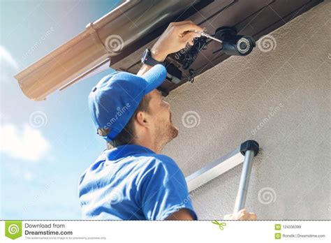 Man Install Outdoor Surveillance Ip Camera For Home Security Stock Image Image Of Home