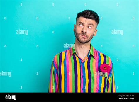 Photo Of Minded Pensive Man Bite Lips Look Empty Space Contemplate