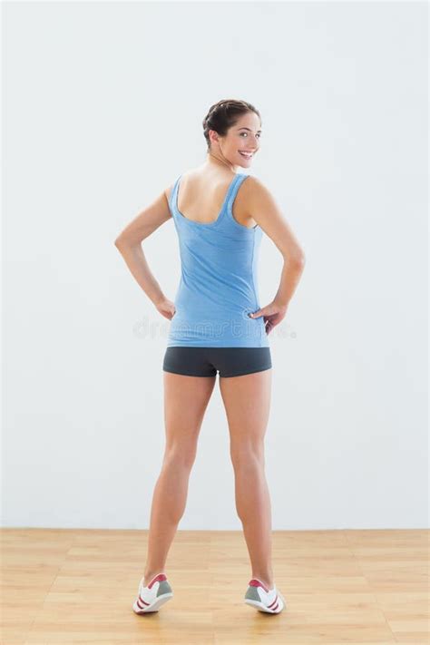 Rear View Portrait Of A Smiling Woman Tip Toeing Stock Image Image Of