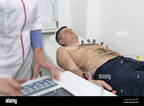 Medical Equipment For Electrocardiogram Doctors Doing Ecg Test On Male
