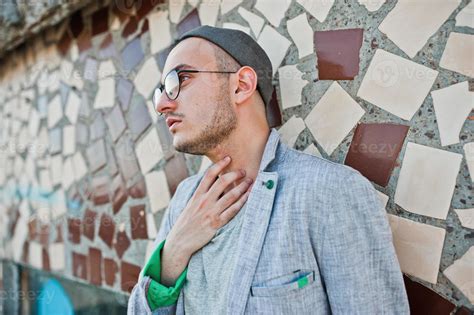 Dreamer Stylish Macho Man In Gray Suit Hat And Glasses Posed On The