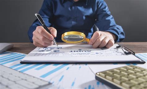Premium Photo Man Holding Magnifying Glass With A Graphs And Charts Business Analysis