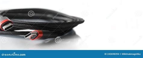 Two Red Black Usb Type C Connectors And Black Braided Wire On Light Background Device For