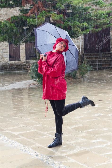 Girl Dancing In Rain With Umbrella