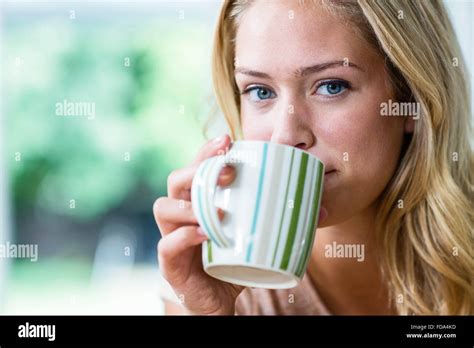 Pretty Blonde Woman Drinking Tea Stock Photo Alamy