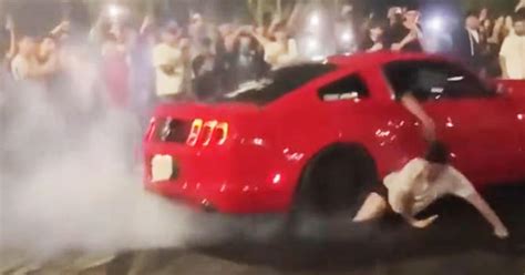 Watch Guy Gets Pantsed By A Mustang Doing A Burnout In Hectic Video
