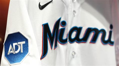 Miami Marlins Baseball Team Wearing Adt Corporate Logo On Jerseys
