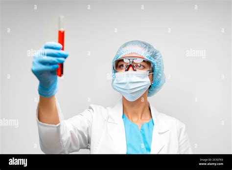 Woman Scientist Holding Laboratory Flask With Chemical Liquid Gray Background Stock Photo Alamy