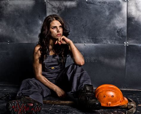 Female Miner Worker With Pickaxe In Coveralls Over His Naked Body Erotic Industry Concept