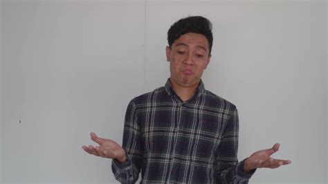 Young Men Indonesian I Dont Know Gesture And Shrug Shoulder Up Gesture