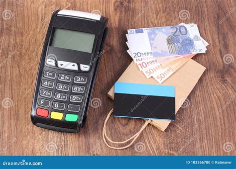 Payment Terminal With Credit Card Currencies Euro And Paper Shopping Bag Concept Of Paying For